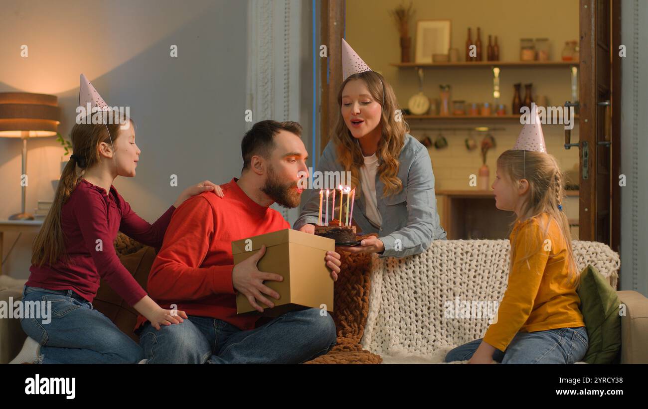 Happy birthday event Caucasian family mom children congratulate dad ...