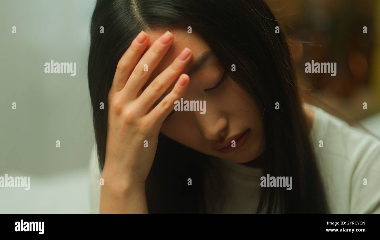 Upset sad frustrated Asian girl stress problem health unwell sick ...