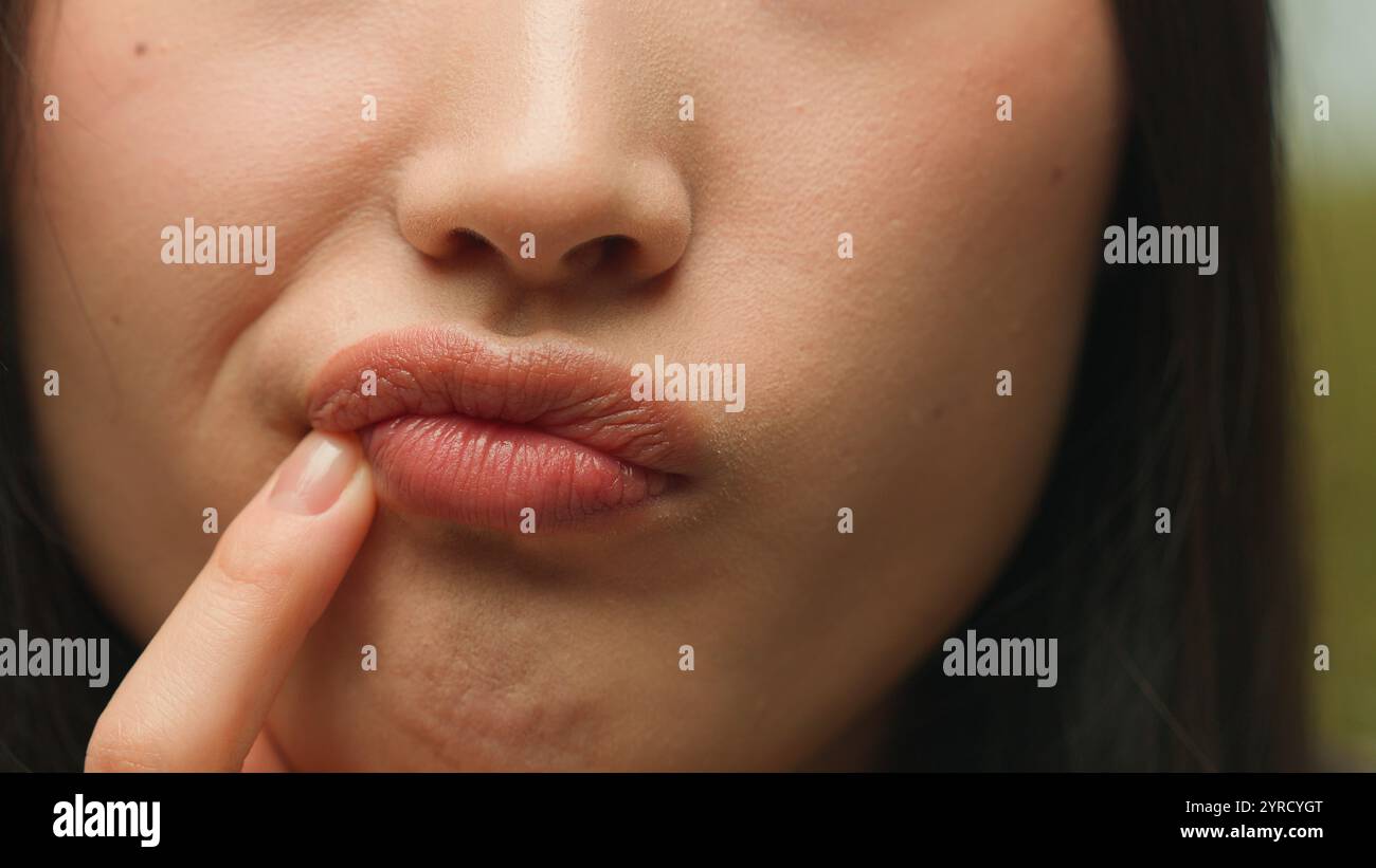 Extreme close up female lips chin pensive thoughtful unrecognizable ...