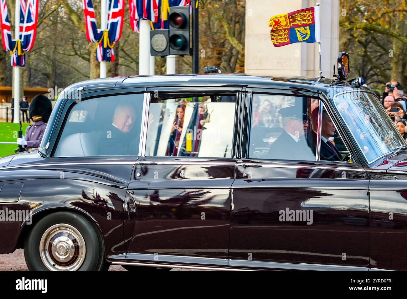London, UK. 3rd December, 2024. King Charles waves to the crowd as he ...