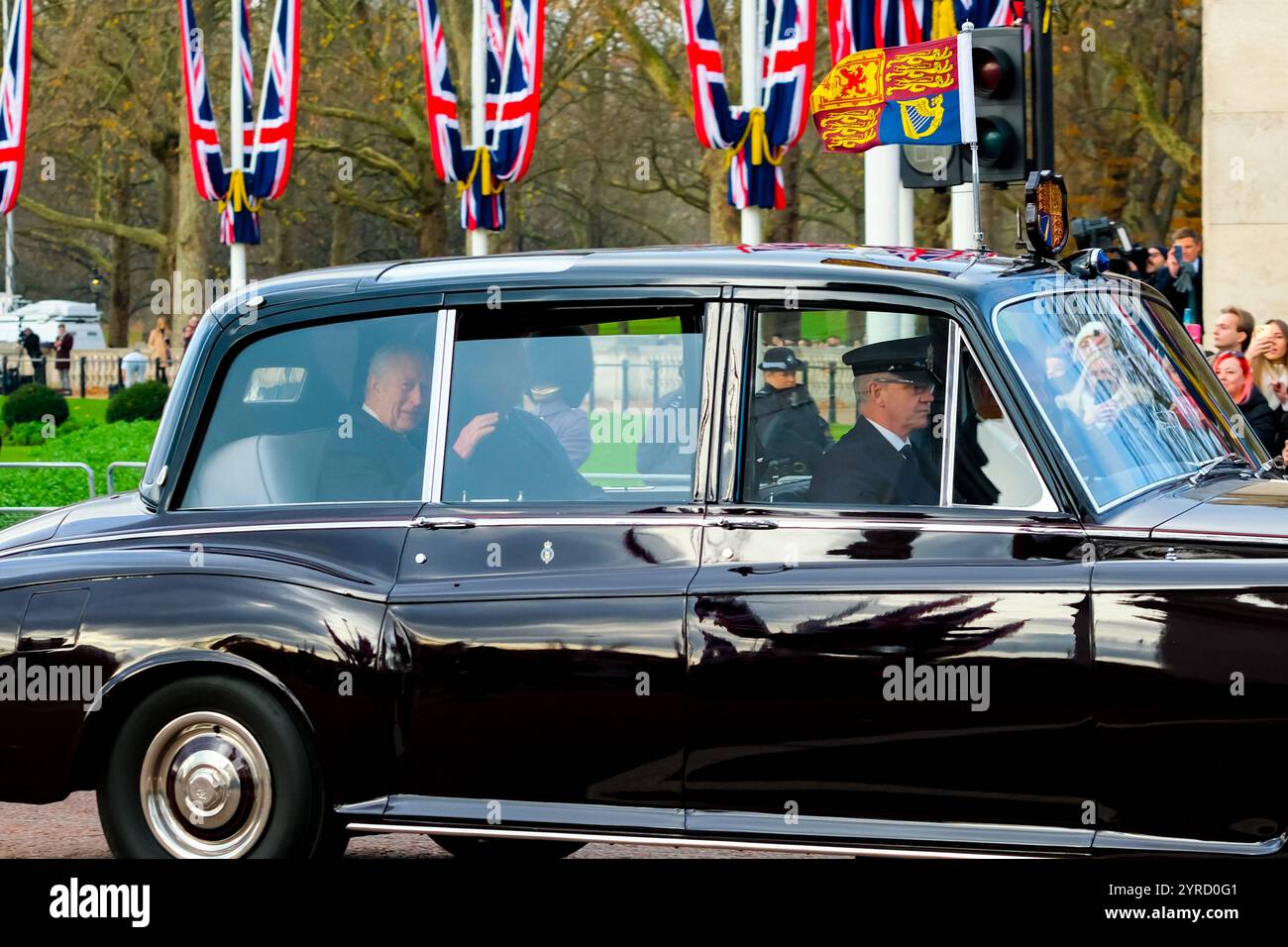 London, UK. 3rd December, 2024. King Charles waves to the crowd as he ...