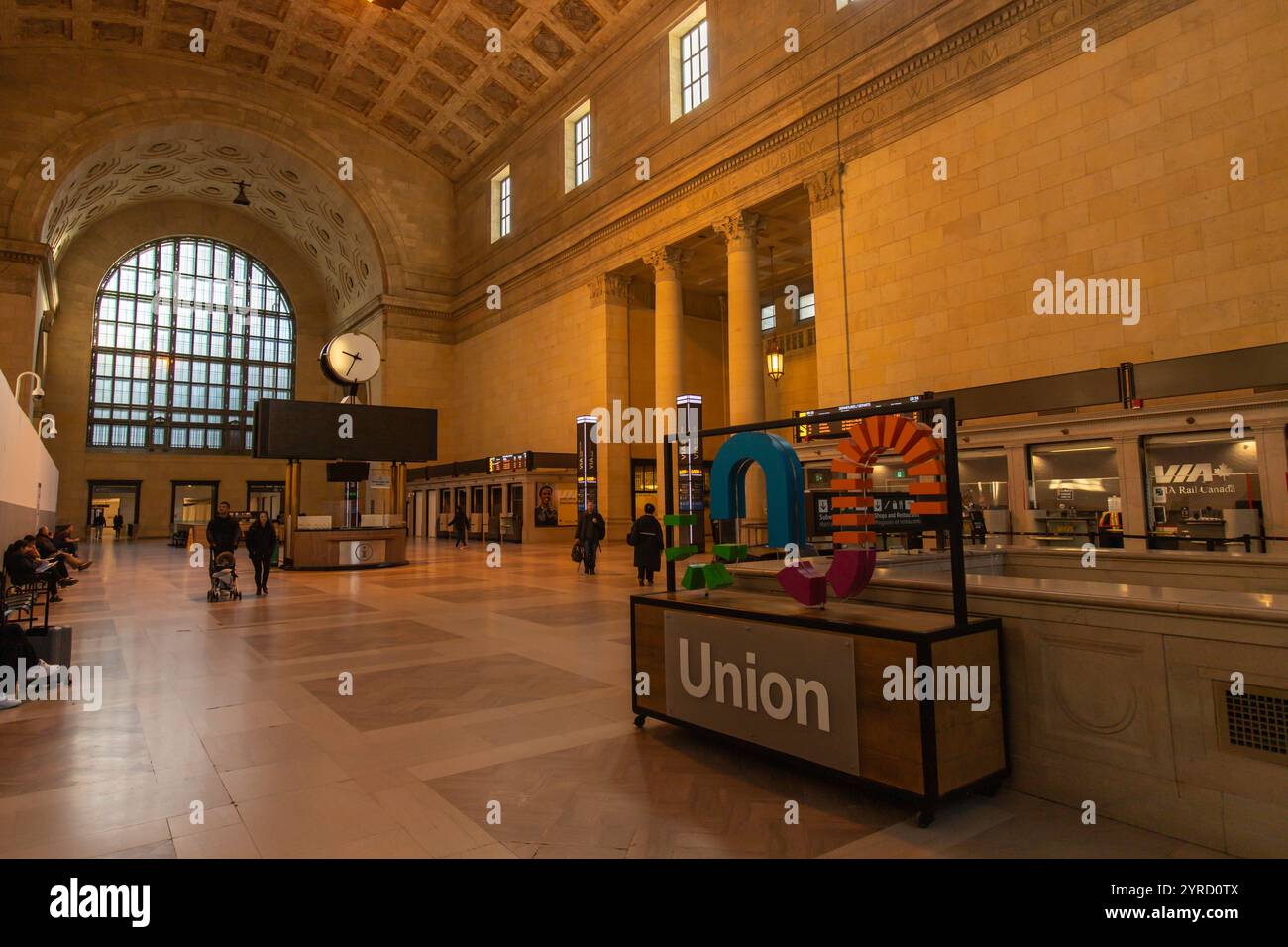 Spacious interior of Union Station in Toronto, featuring arched windows ...