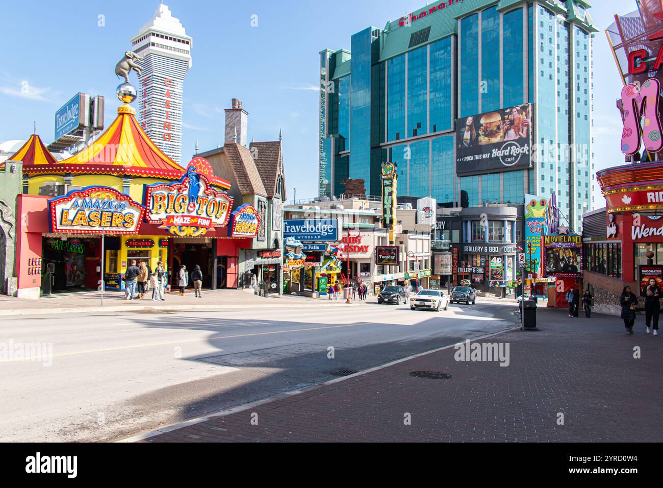 Bustling Clifton Hill street in Niagara Falls, featuring colorful ...
