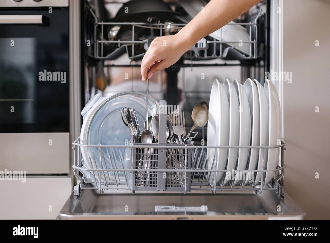 Open dishwasher clean cutlery female hi-res stock photography and ...