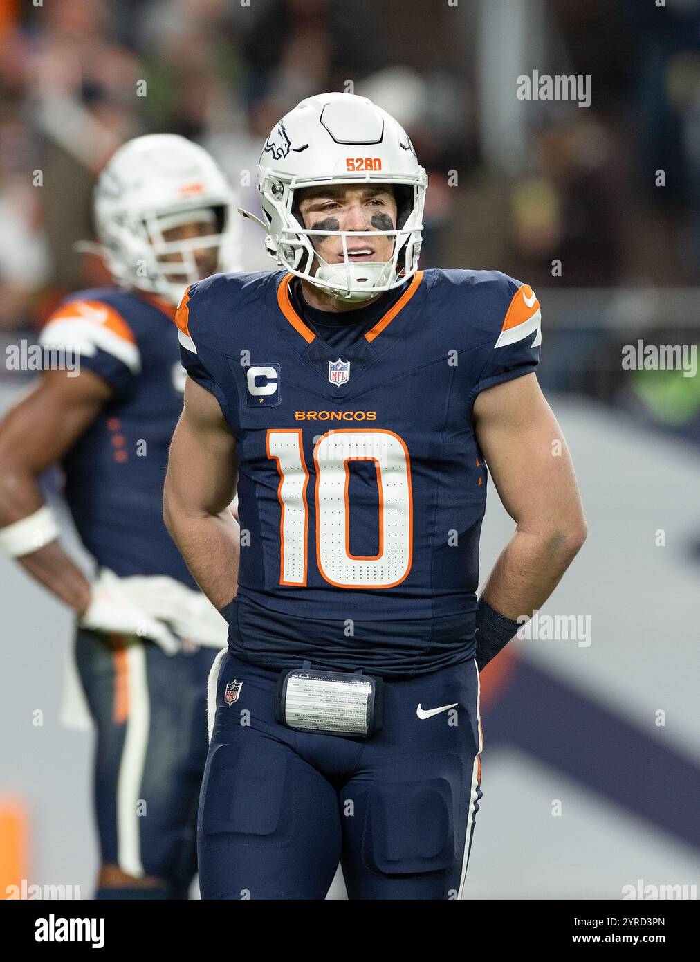 December 3, 2024, Denver, Colorado, USA: Broncos QB BO NIX warms his ...