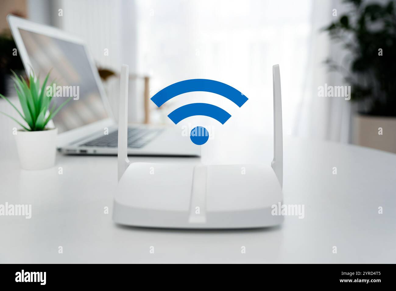 Modern wi-fi router on light table in living room Stock Photo - Alamy