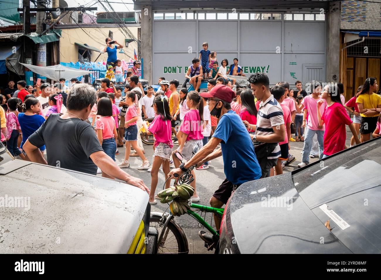 Crowds watch the wonderful religious festival parade make its way through the busy streets of ...