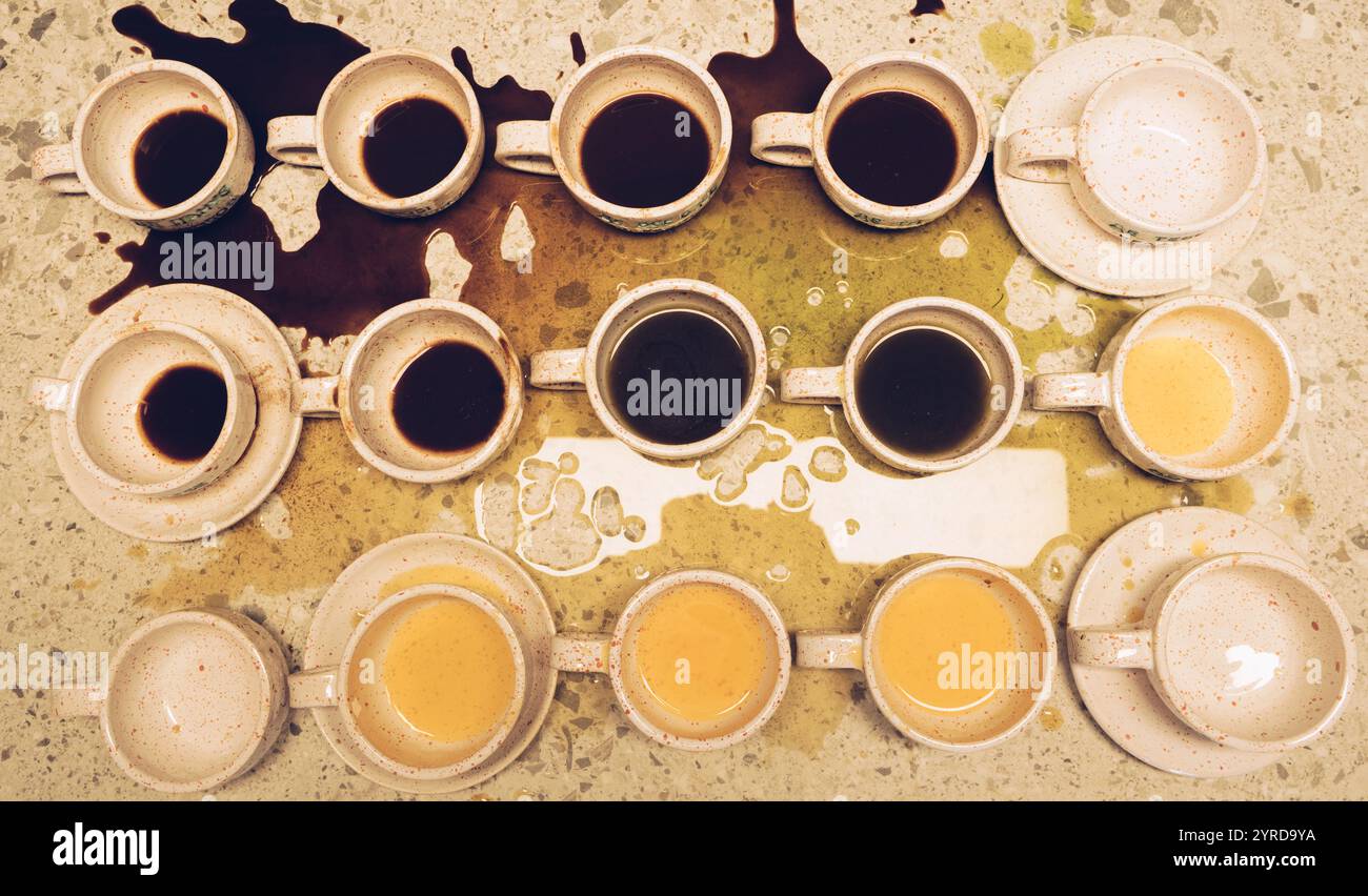 Spilled coffee streaks across the surface, its shiny texture ...