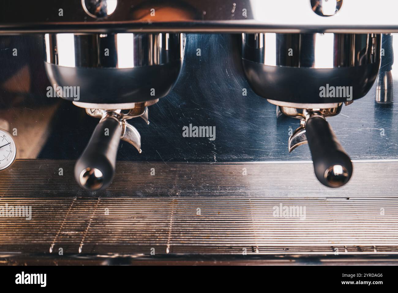 A close-up of the coffee machine reveals its durable construction, with ...