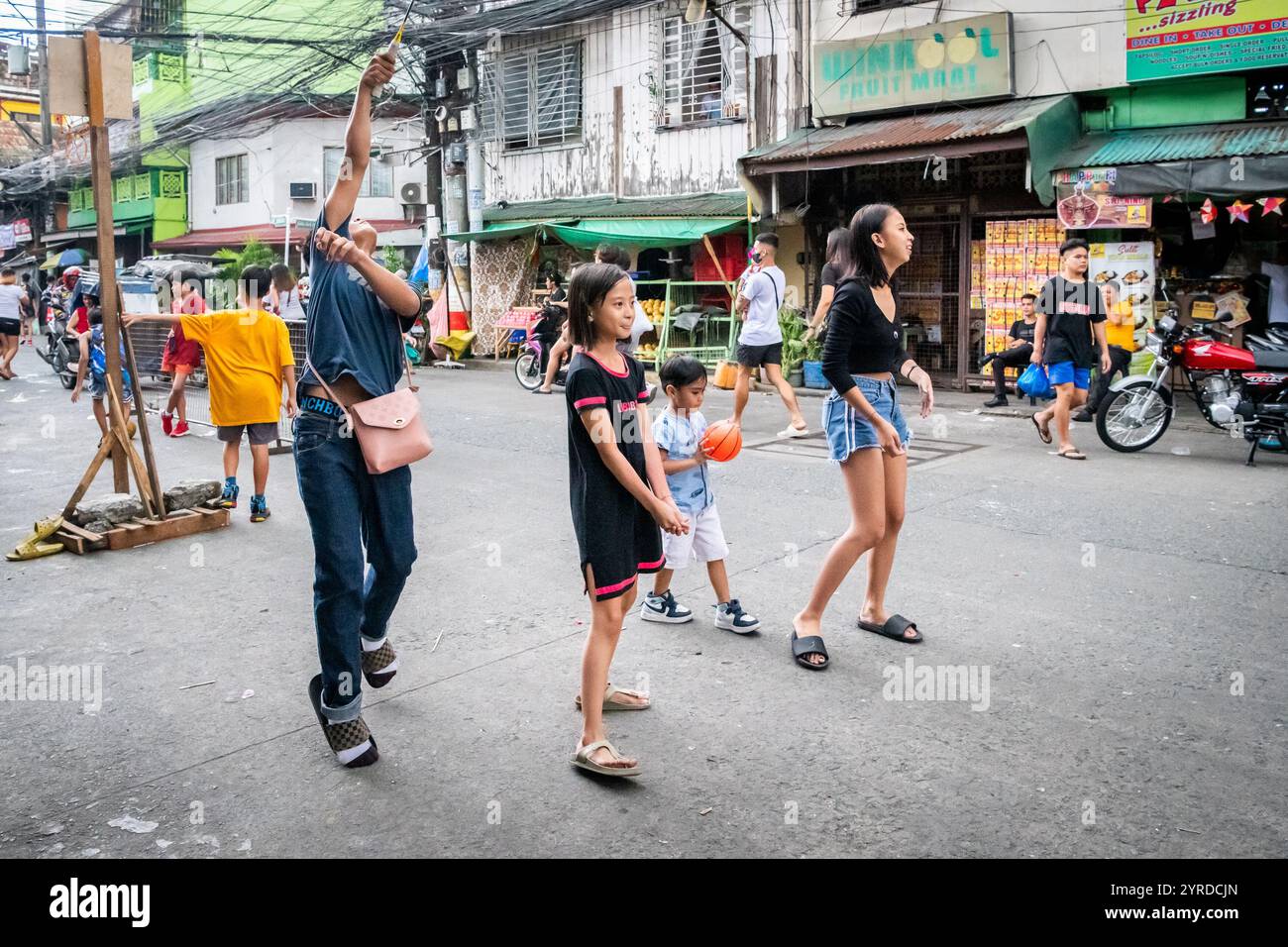 Cute Filipino children play volleyball in the street in The Tondo ...
