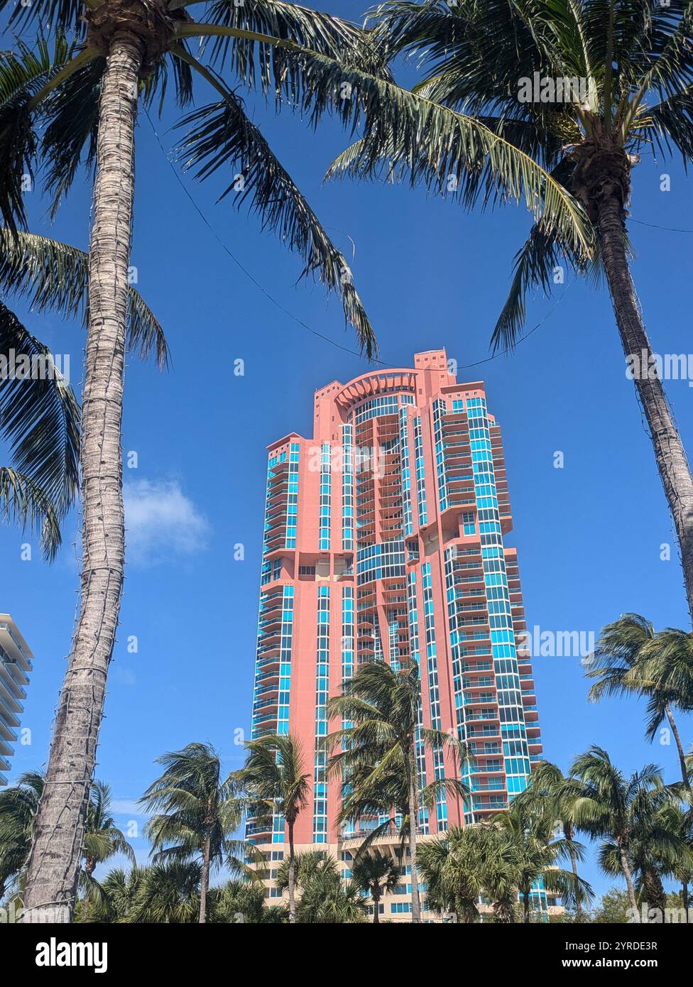 Pink and green sky scraper in Miami Beach Stock Photo - Alamy