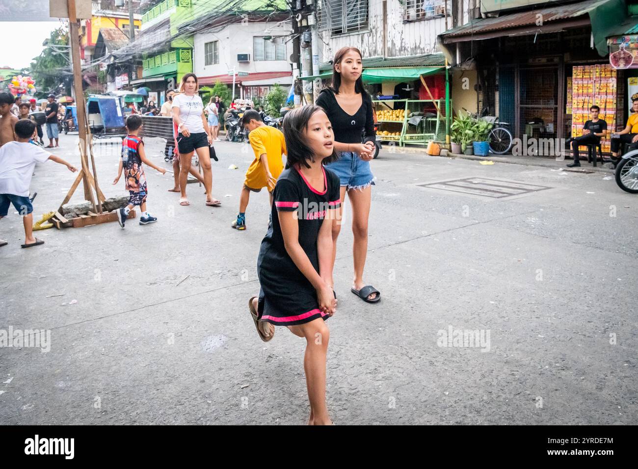 Cute Filipino children play volleyball in the street in The Tondo ...