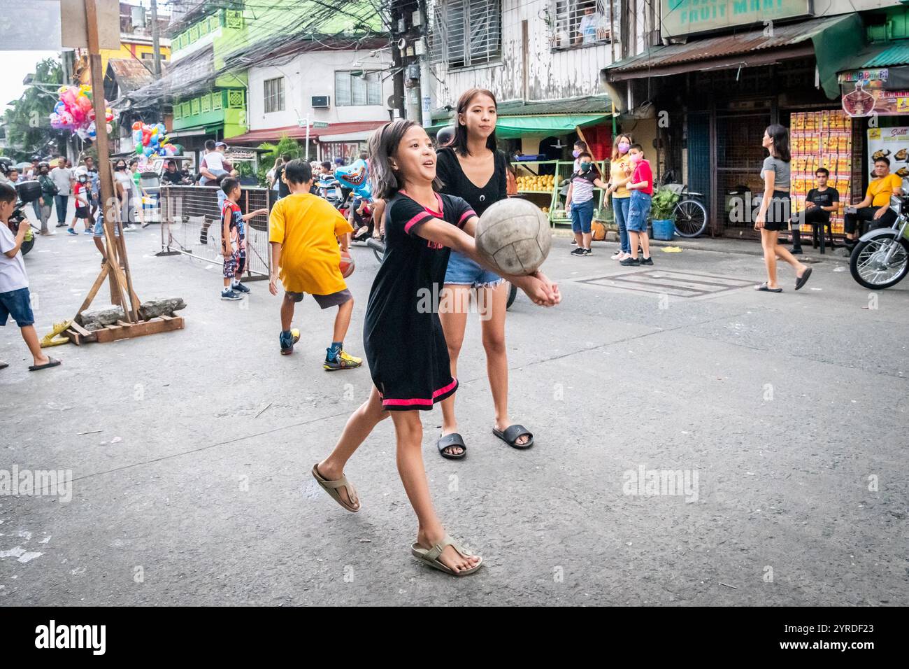 Cute Filipino children play volleyball in the street in The Tondo ...