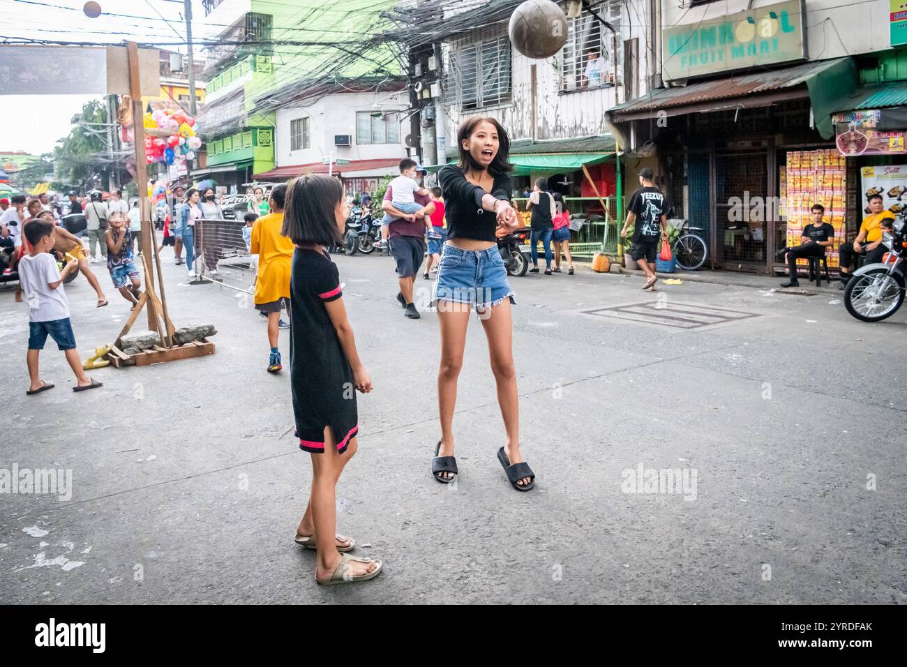 Cute Filipino children play volleyball in the street in The Tondo ...