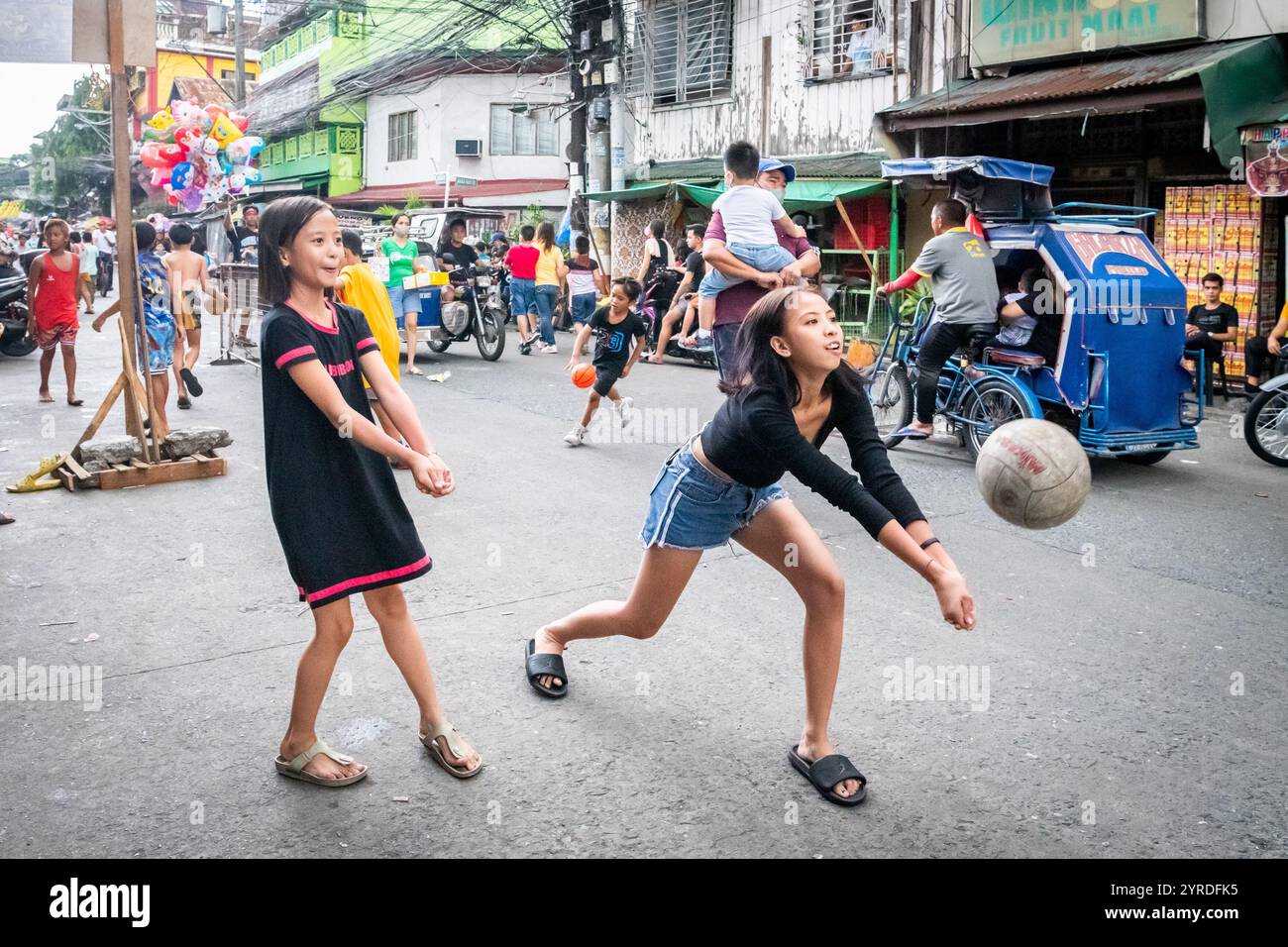 Cute Filipino children play volleyball in the street in The Tondo ...