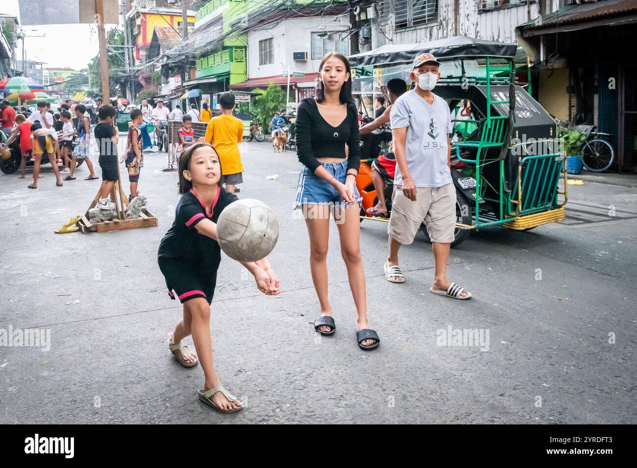 Cute Filipino children play volleyball in the street in The Tondo ...