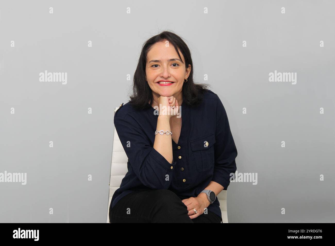 40-year-old executive woman in her office chair shows her leadership ...