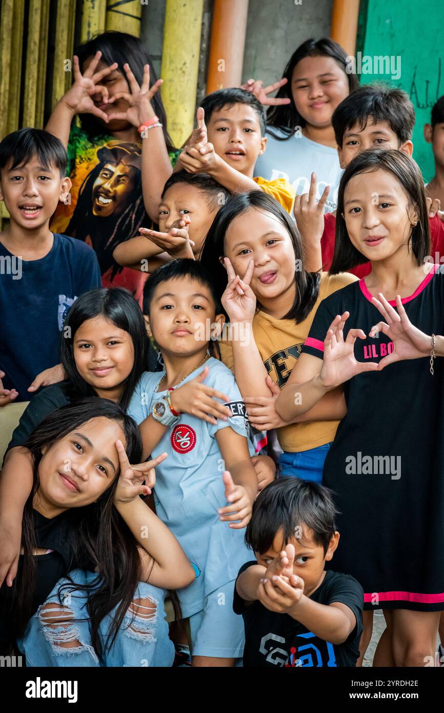 Crowds of cute Filipino children all happily pose and smile for the ...
