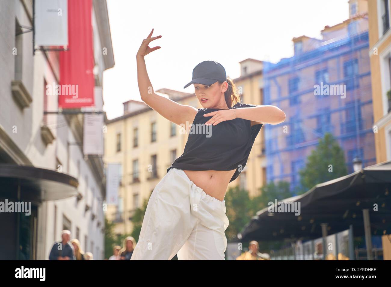 Woman dancing in the street with modern movements Stock Photo - Alamy