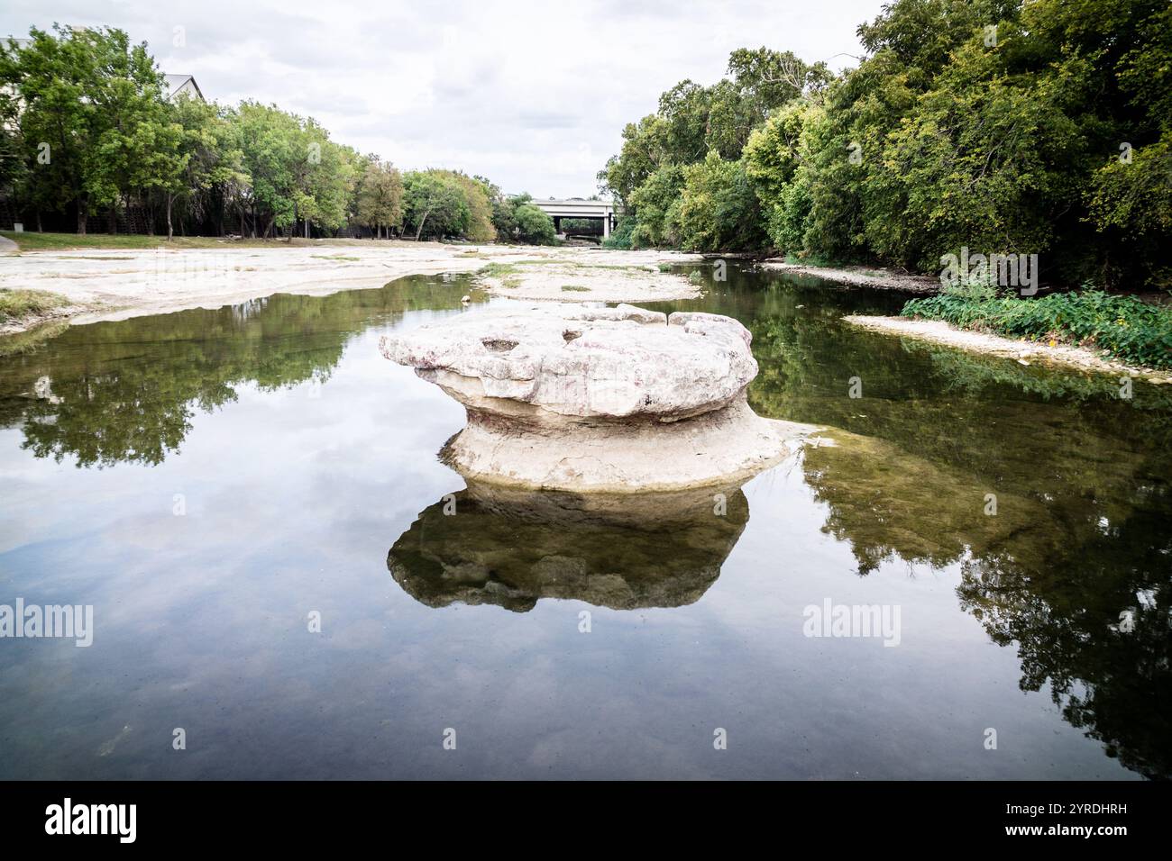 Unique Rock Formation in Serene Creek with Tree Reflection Stock Photo ...