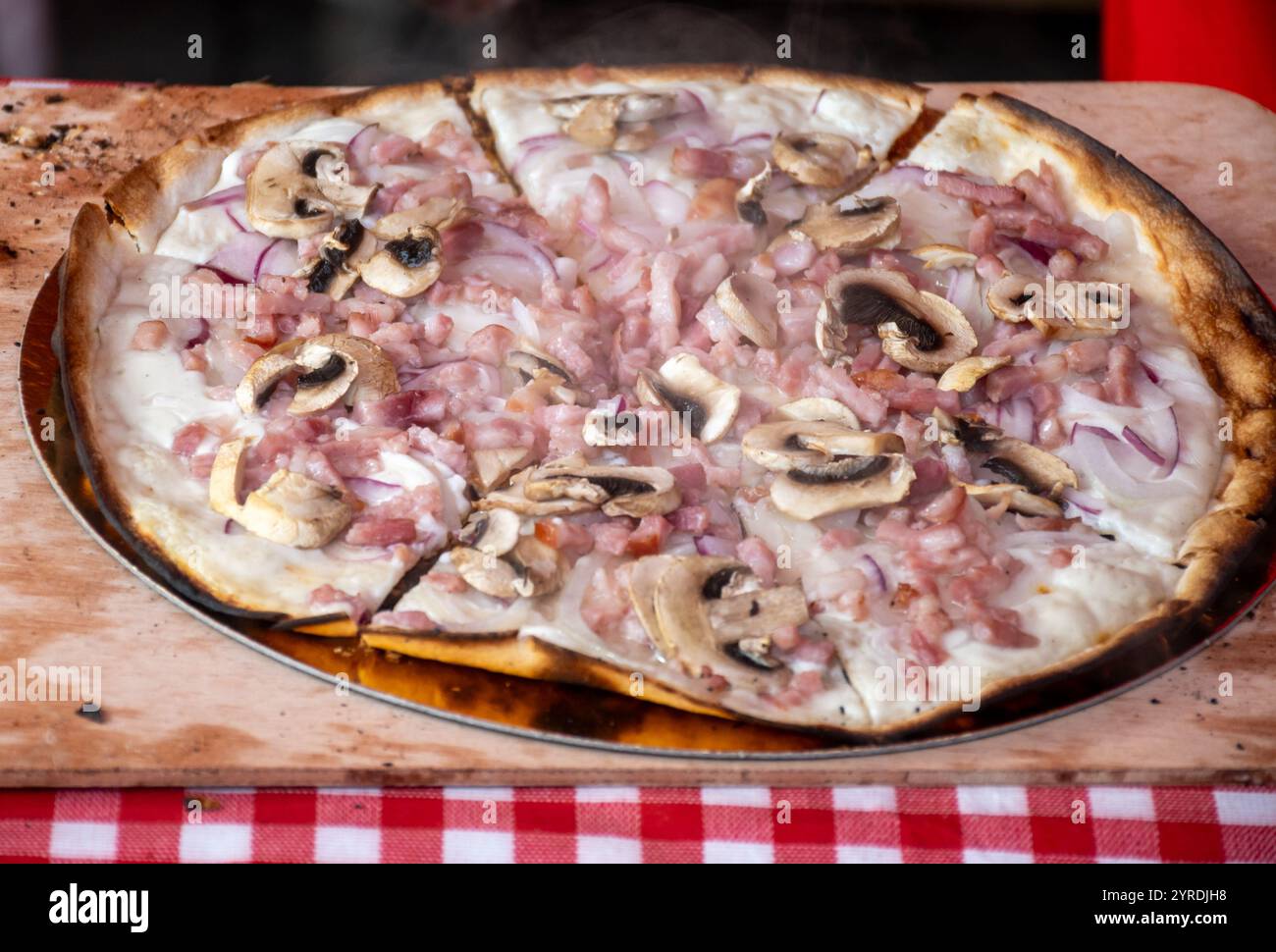 Traditional food of Alsace, flammekuche wood oven baked tarte with ...