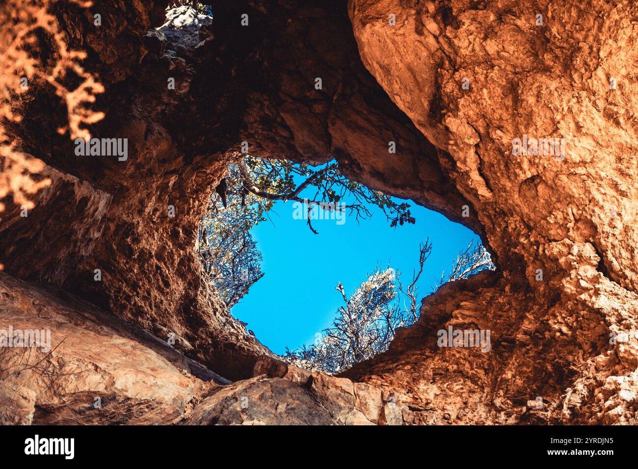 A breathtaking view from inside a natural rock formation, showing the ...