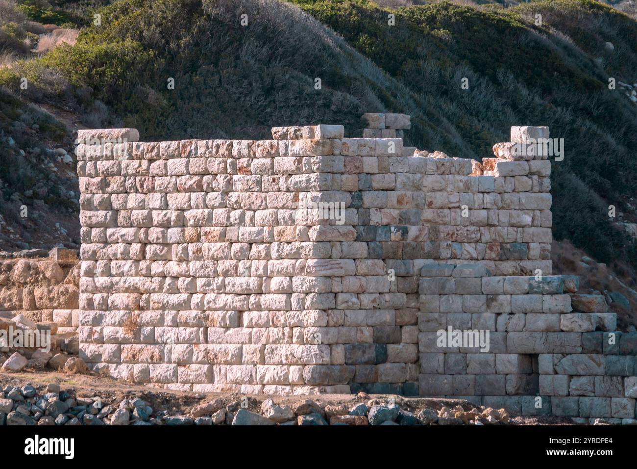 Ancient stone structure and wall amid natural landscape Stock Photo - Alamy