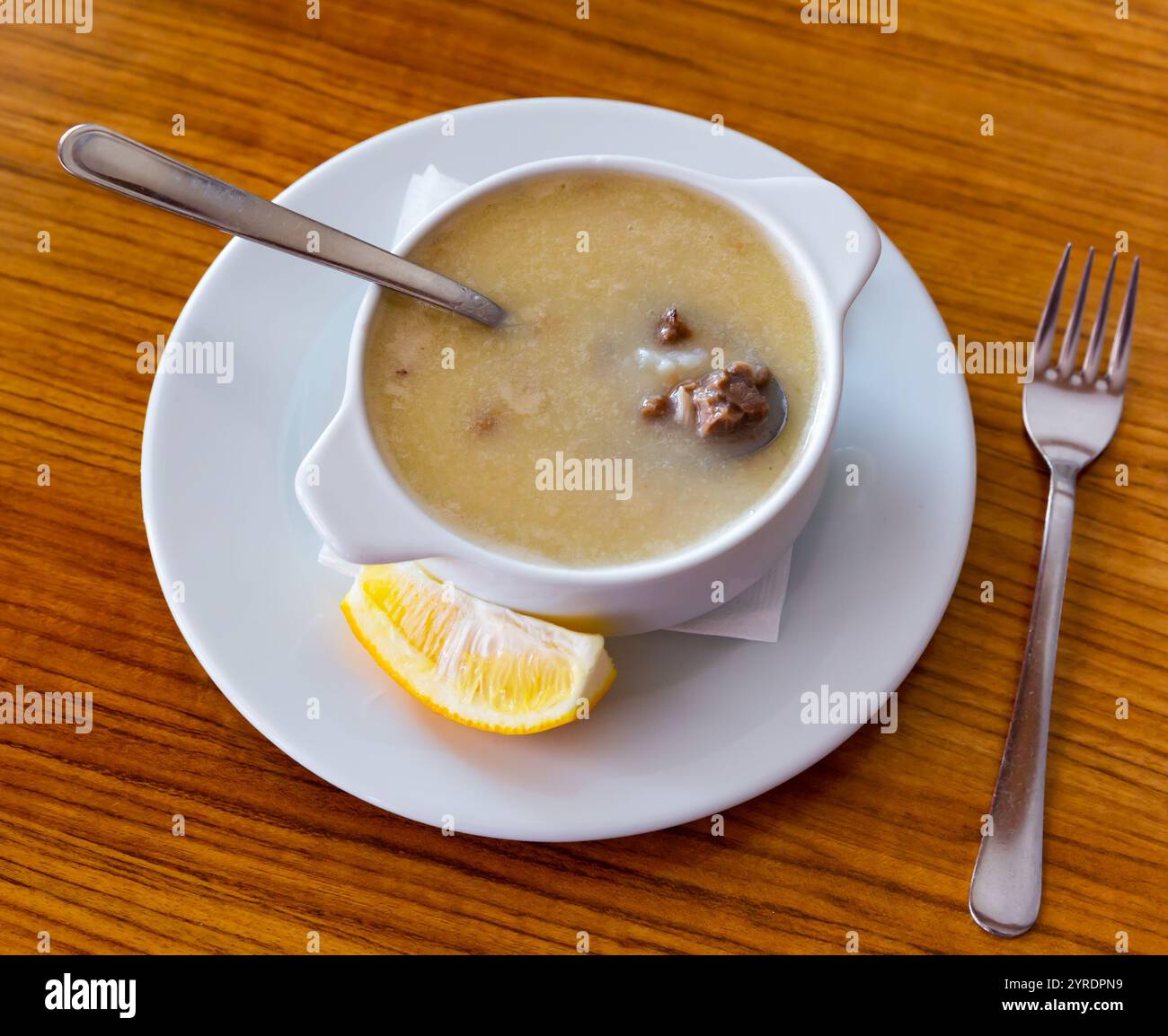 Turkish soup Paca corbasi served with lemon slice Stock Photo - Alamy