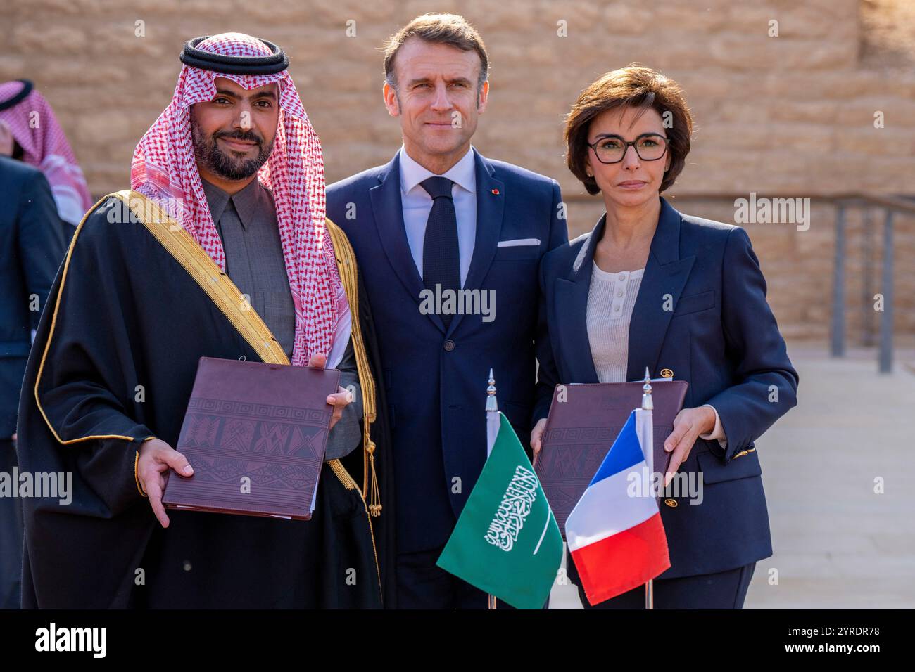 In this photo provided by the Saudi Ministry of Media, French President ...