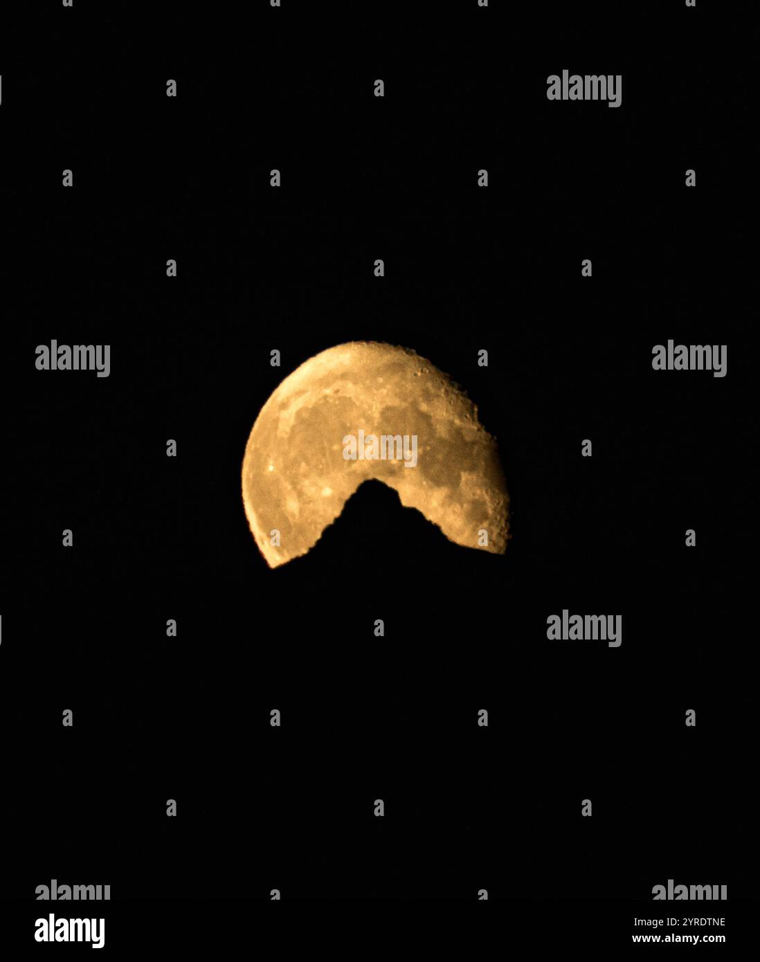 An almost full moon rises behind the Alps at night Stock Photo - Alamy