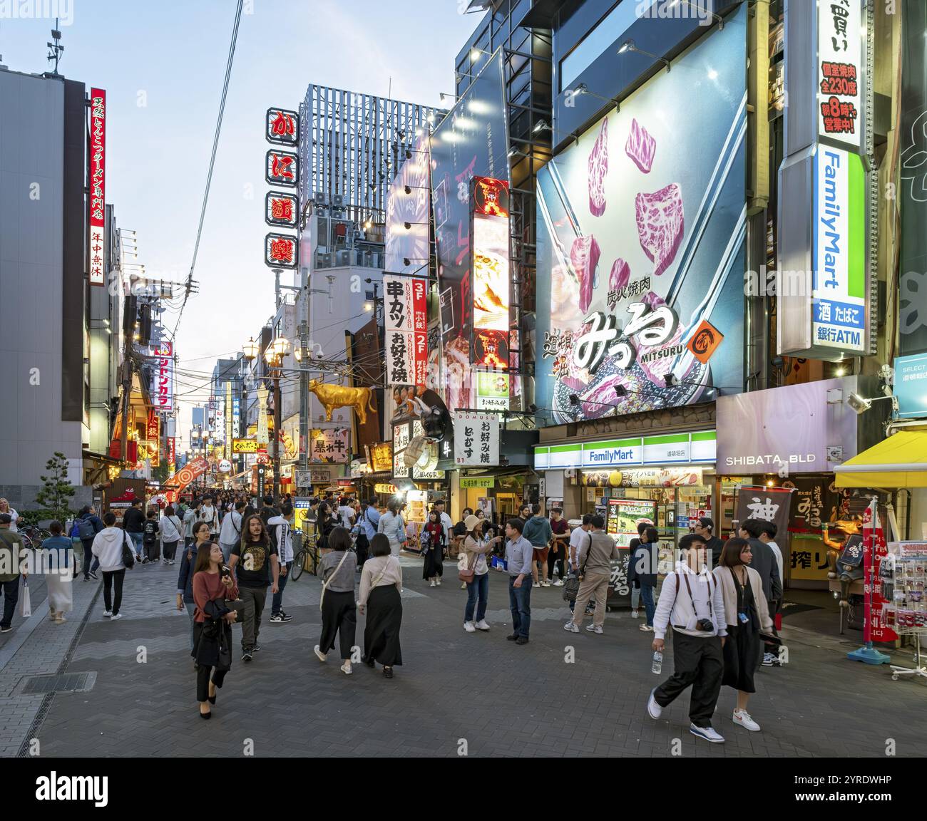 Night-time street with neon lights and illuminated signboards ...