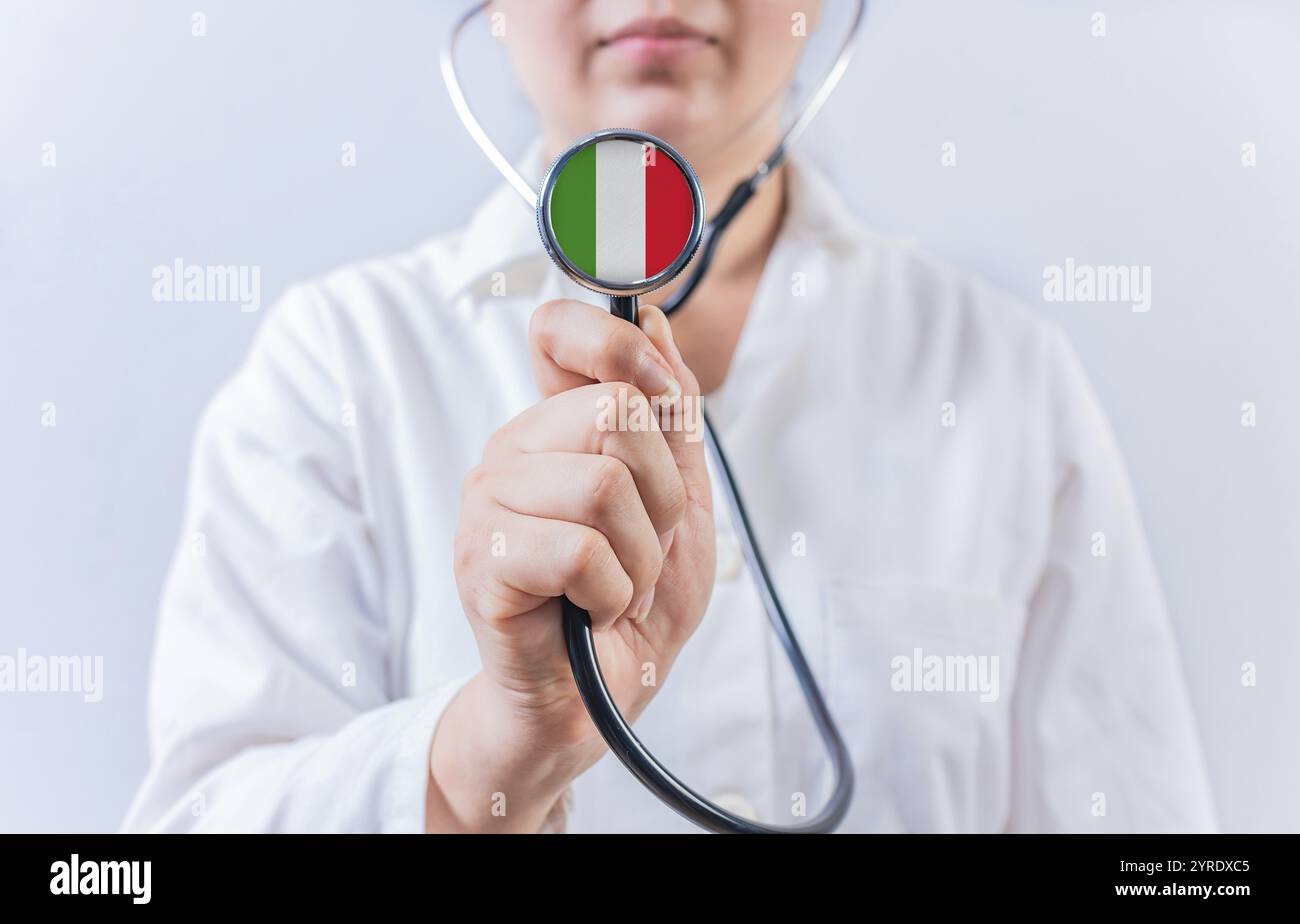 Doctor holding stethoscope with Italy flag. National Health System of ...