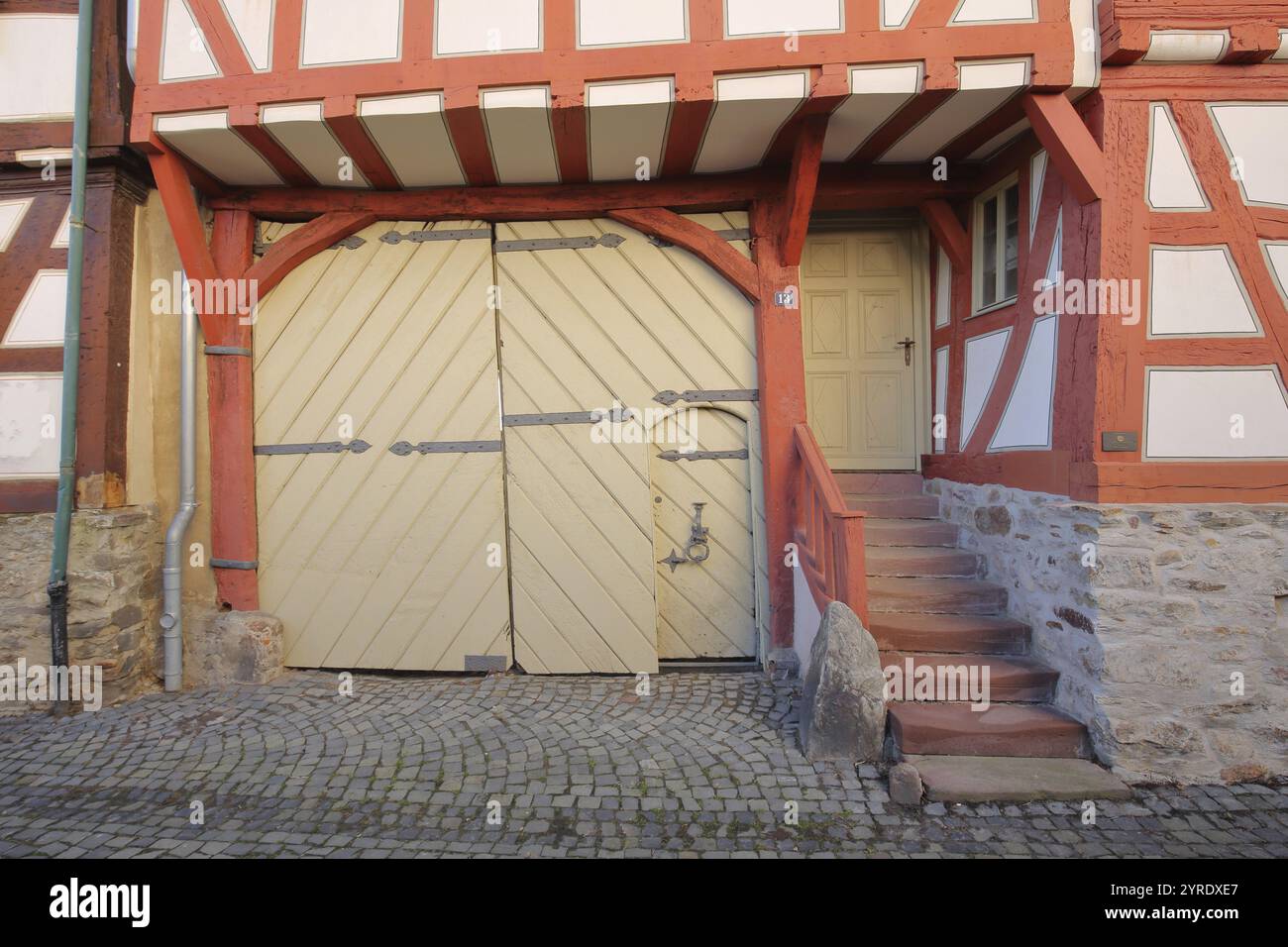 Entrance with gate and stairs to the red half-timbered house, house ...