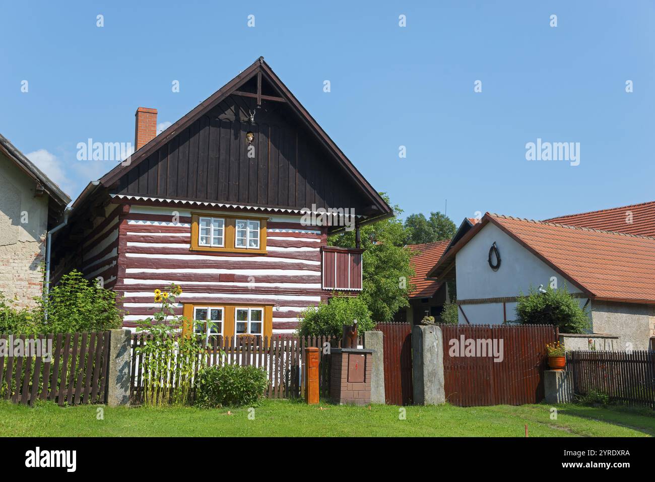 A traditional wooden house with residential facilities and a garden ...