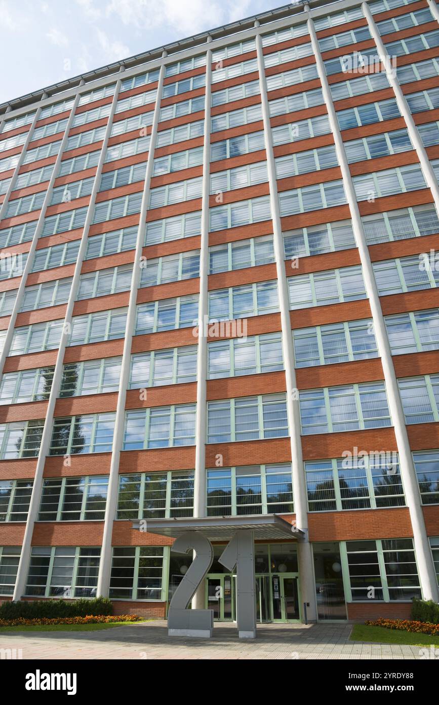 Tall office building with symmetrical window elements and a modern ...