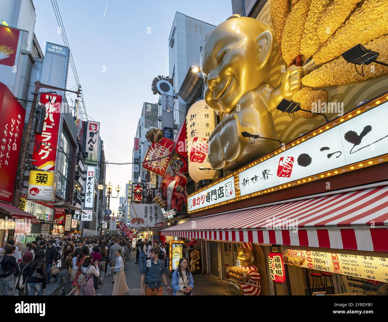 Night-time street with neon lights and illuminated signboards ...