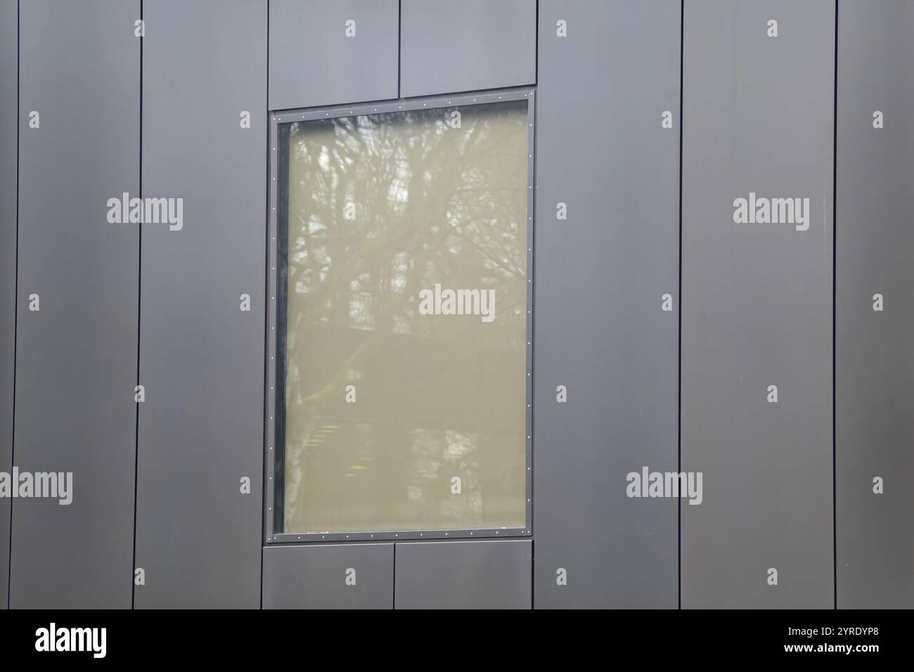 Modern metal building with window Stock Photo - Alamy