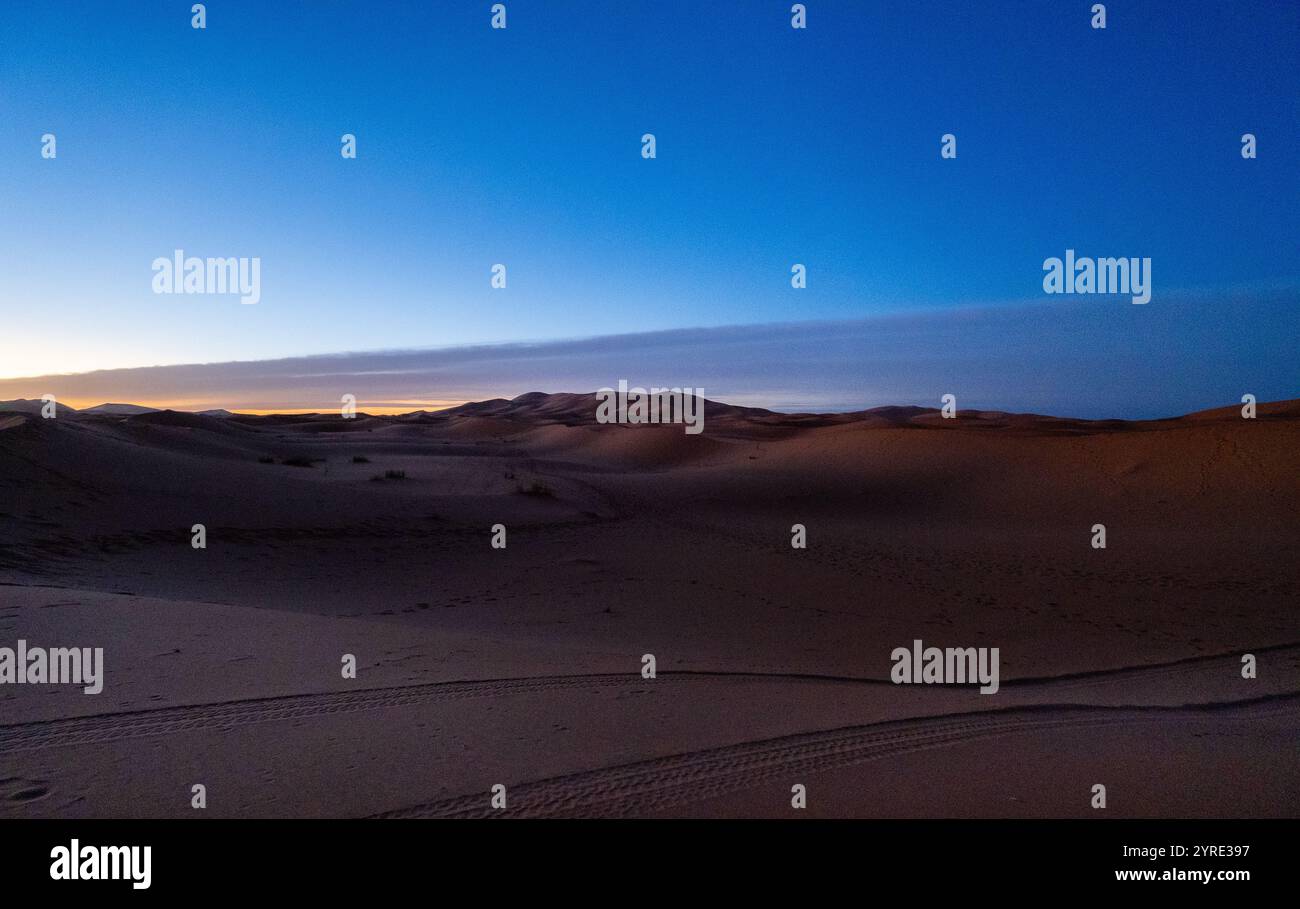 Desert panorama with four by four tire marks signs in the foreground ...