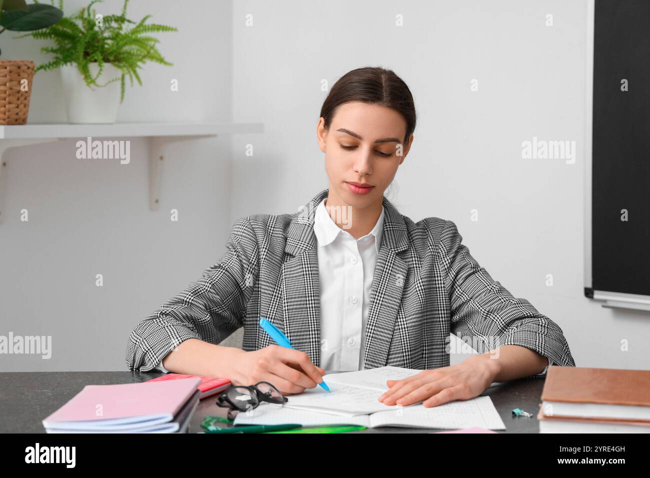 Young math teacher writing hi-res stock photography and images - Alamy