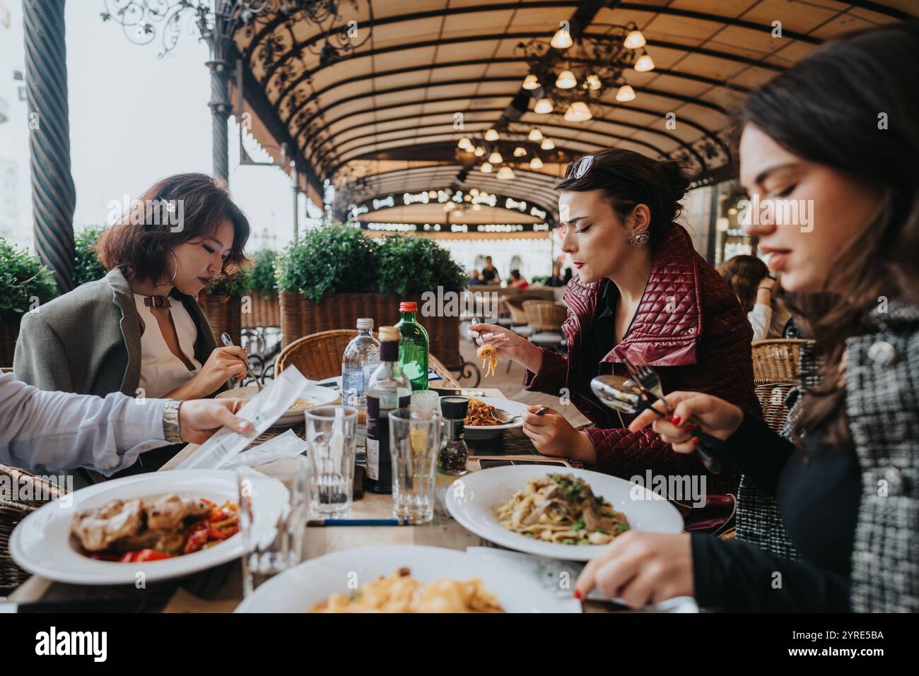 Business people having an outdoor meeting over lunch Stock Photo - Alamy