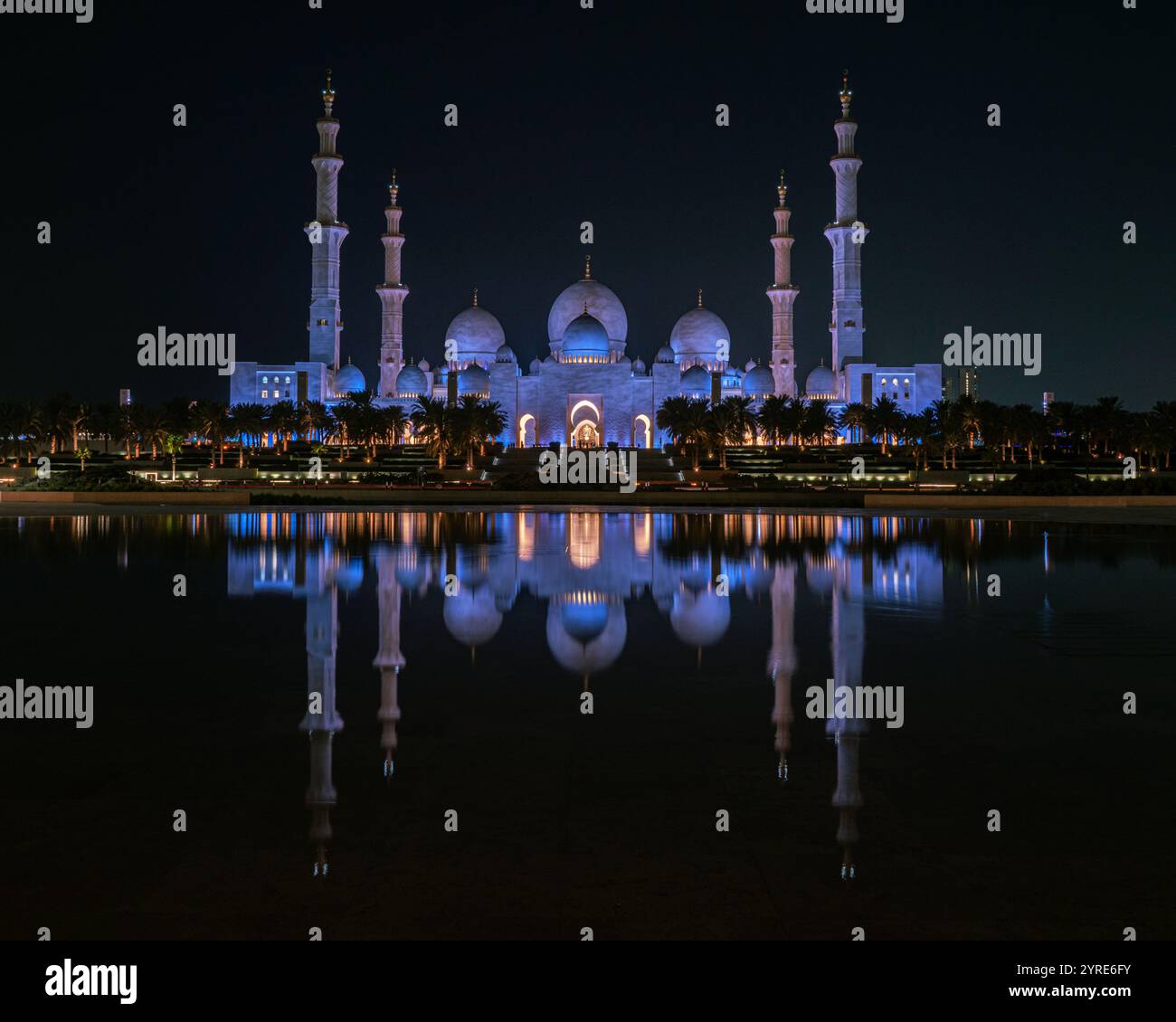 Sheikh Zayed Grand Mosque in Abu-Dhabi glowing in radiant purple at ...