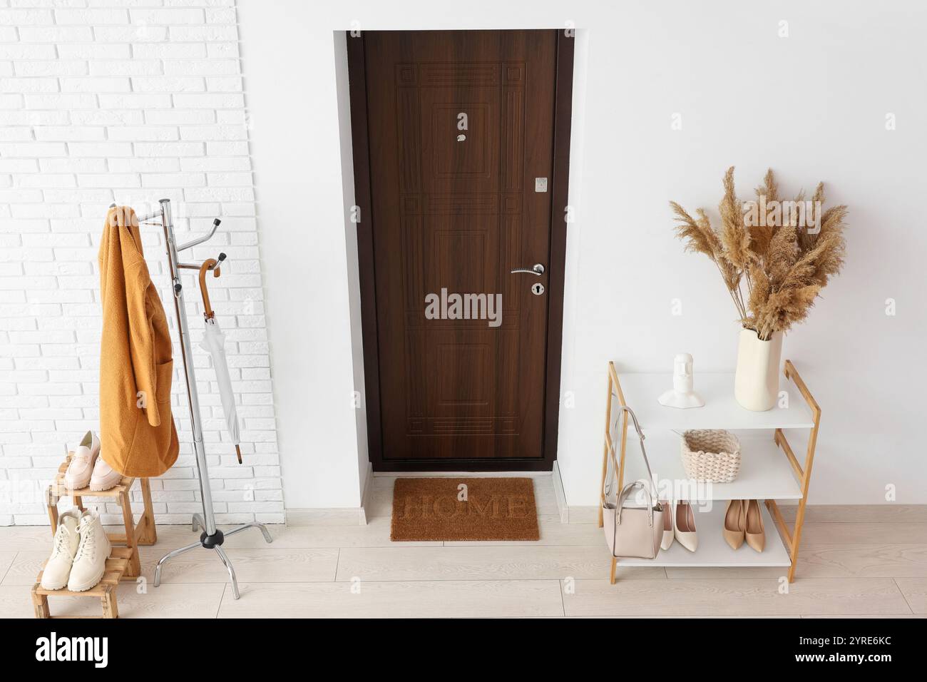 Interior of modern hallway with door mat, rack and shoe stand Stock ...