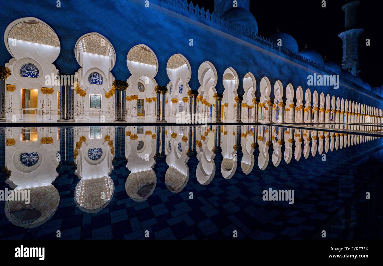Illuminated colonnade of Sheikh Zayed Grand Mosque with stunning ...