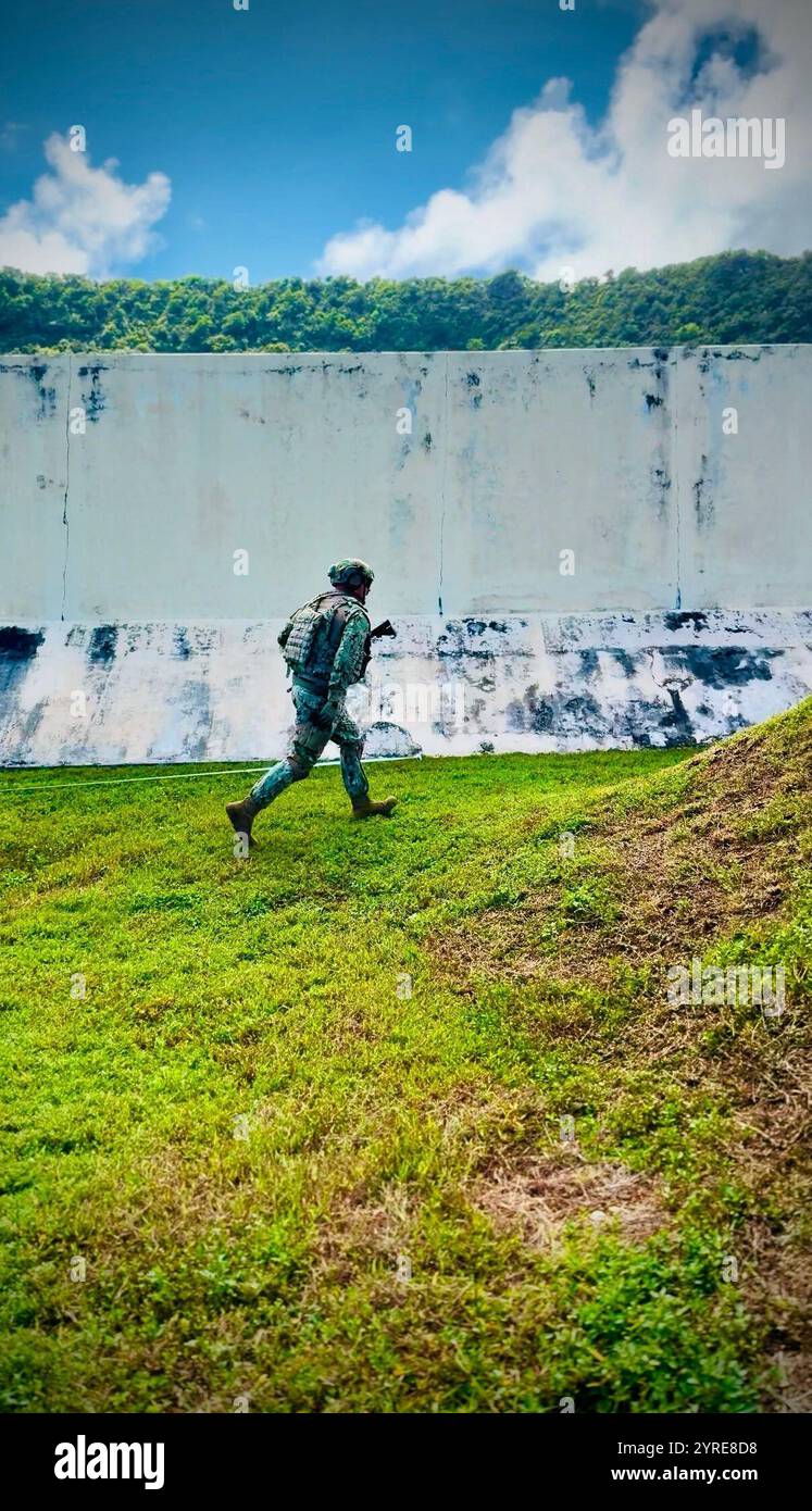 A U.S. Coast Guard Port Security Unit 311 member runs to the last two ...
