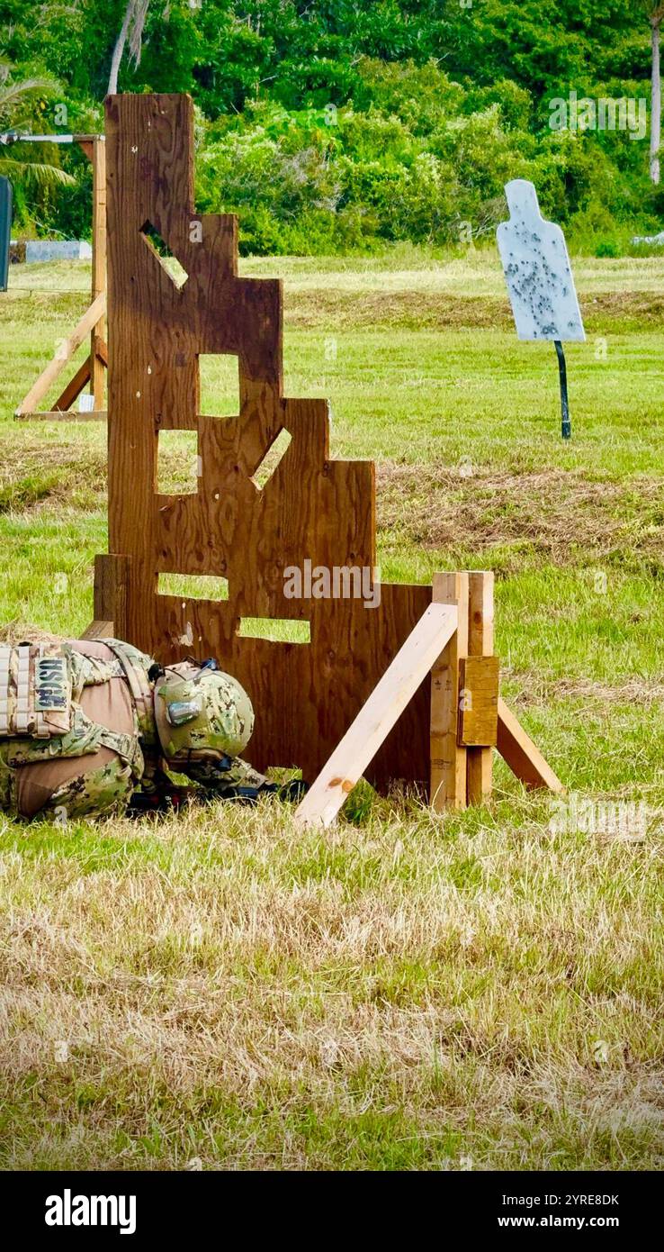 A U.S. Coast Guard team Port Security Unit 311 member shoots through ...