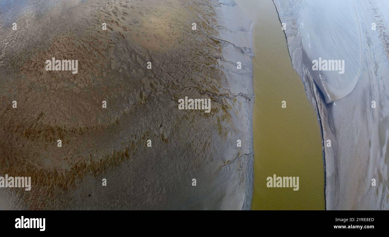 Aerial view of the tidal mudflats and channels of the Eemsdelta ...