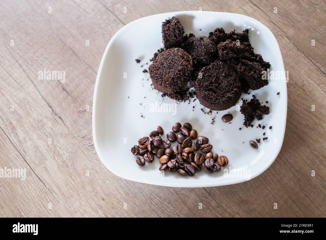 Ground coffee poses from an automatic machine Stock Photo - Alamy