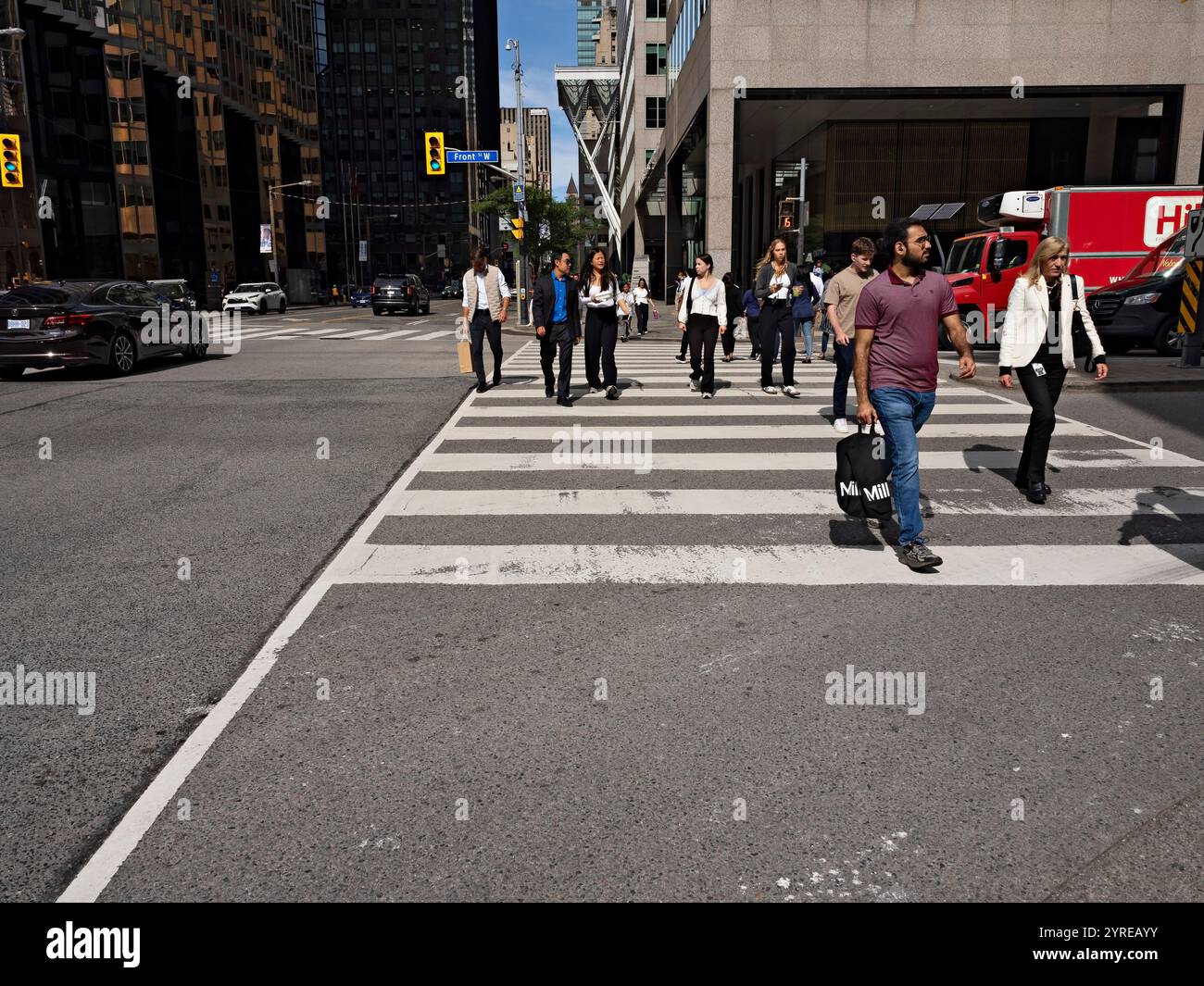 Toronto Canada / Pedestrians walk accross the intersection of Bay ...