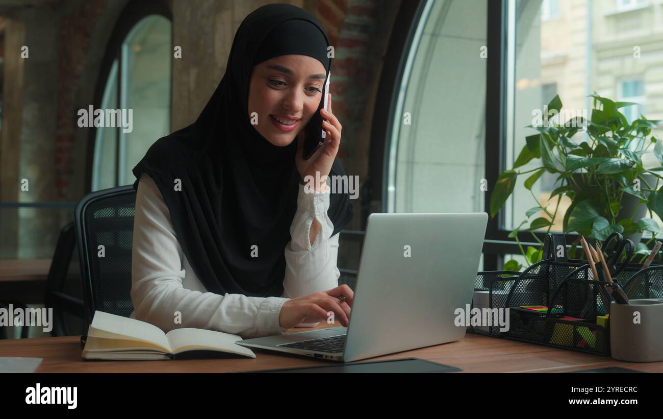 Multitasking happy smiling muslim female hi-res stock photography and ...