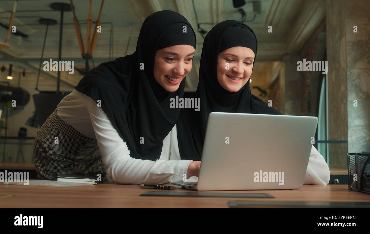 Two Arabian muslim islamic women hijab girls ladies businesswomen ...